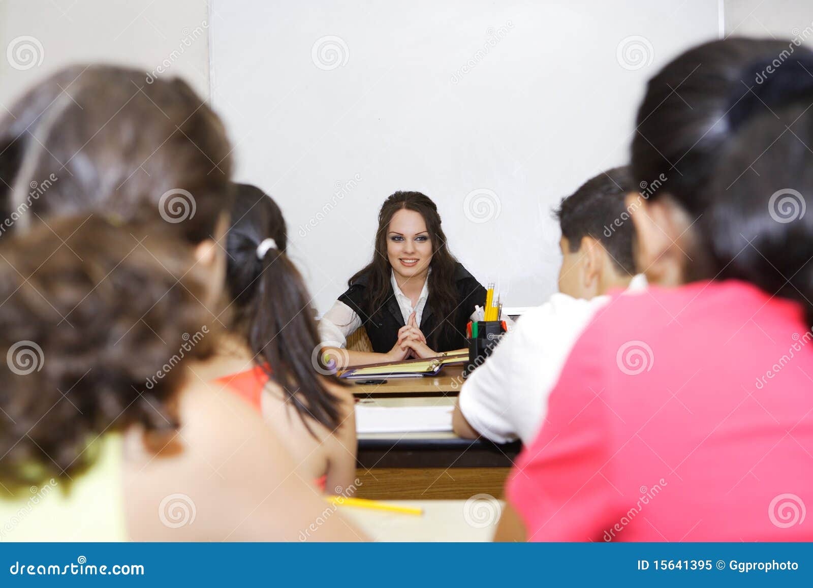 Teacher Sitting in Front of Class Stock Image - Image of focus ...