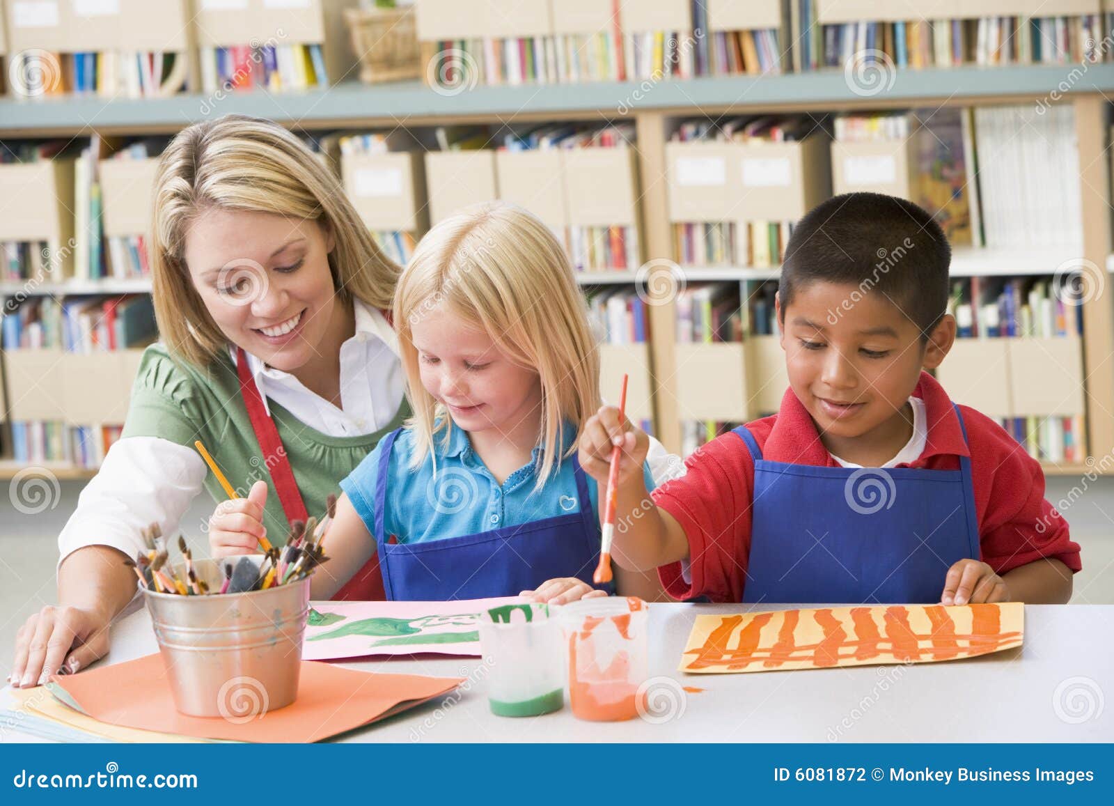 Teacher Sitting with Students in Art Class Stock Photo - Image of ...