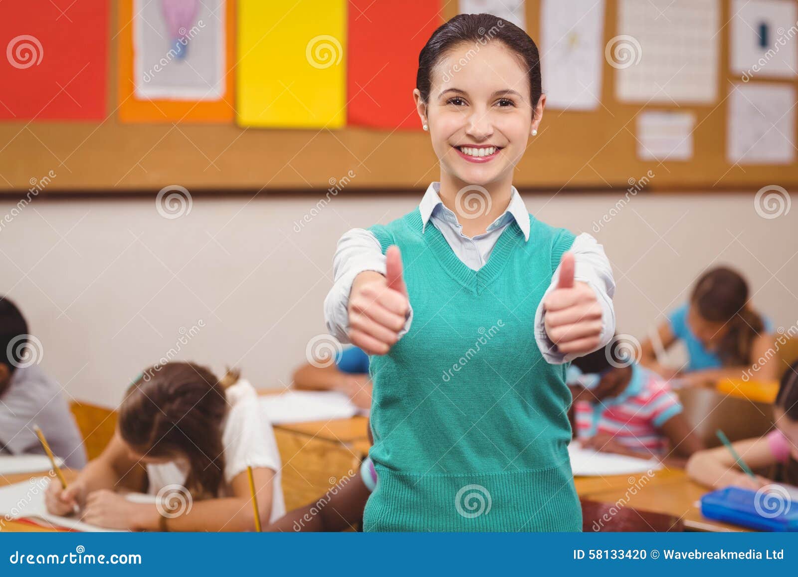 Teacher Smiling at Camera in Classroom Stock Photo - Image of knowledge ...