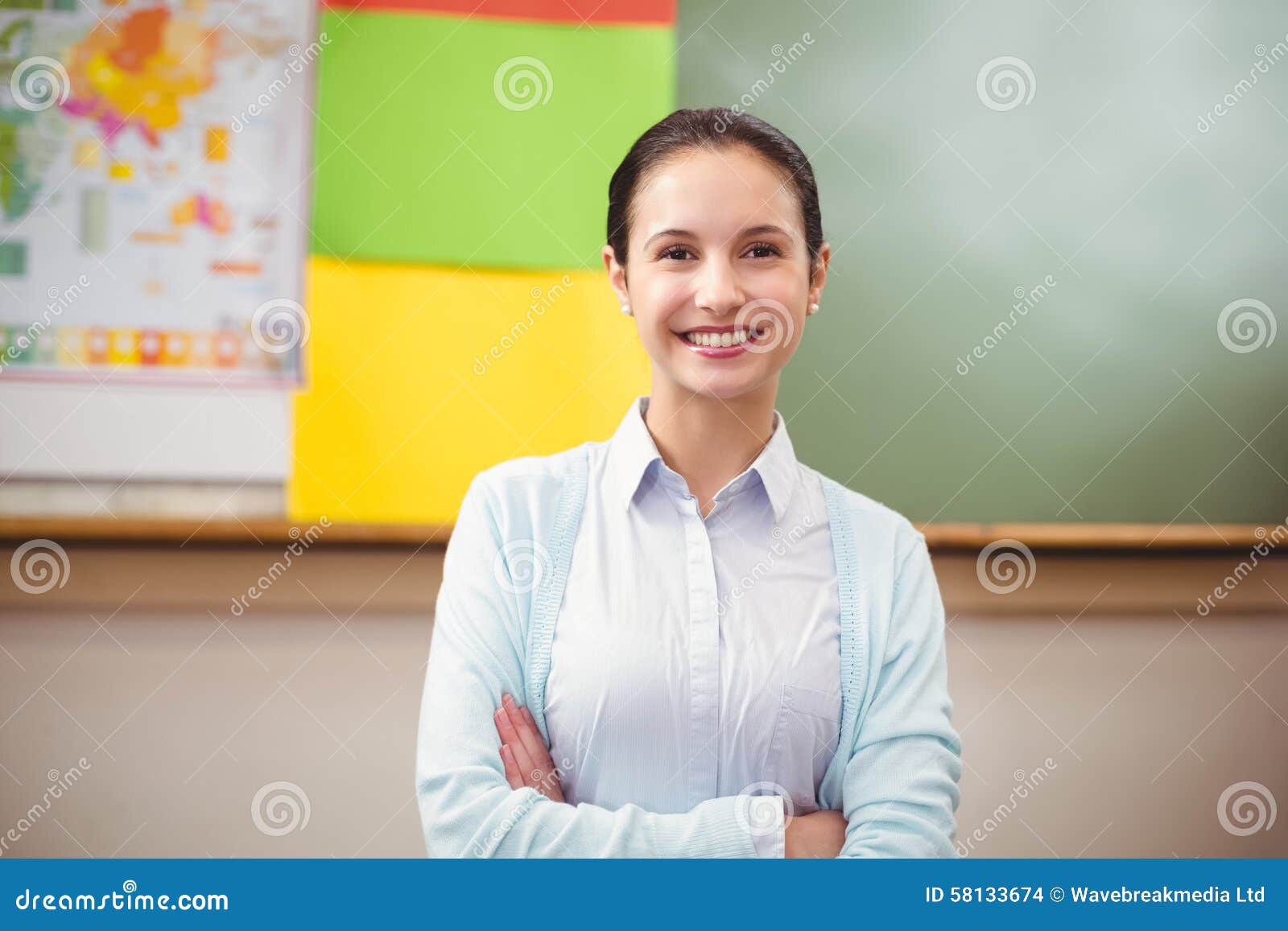 Teacher Smiling at Camera in Classroom Stock Photo - Image of portrait ...