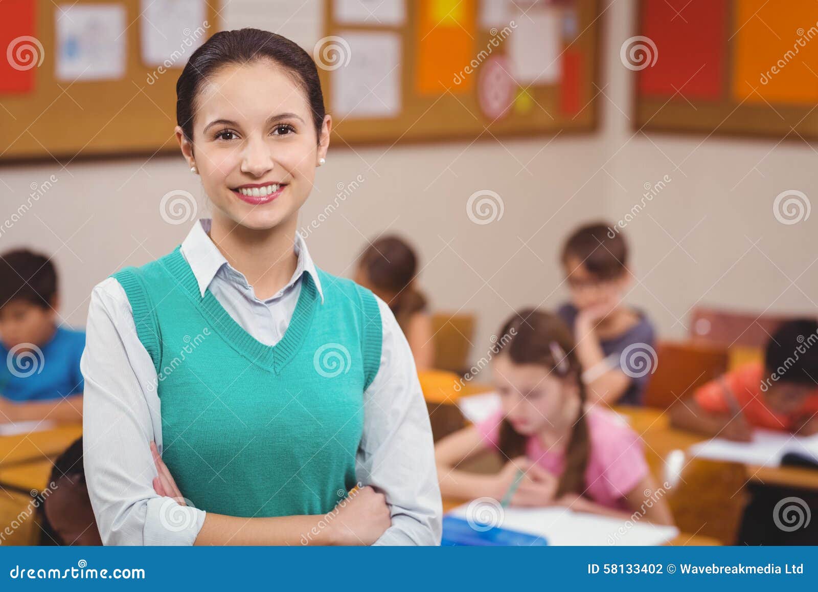 Teacher Smiling at Camera in Classroom Stock Photo - Image of happy ...