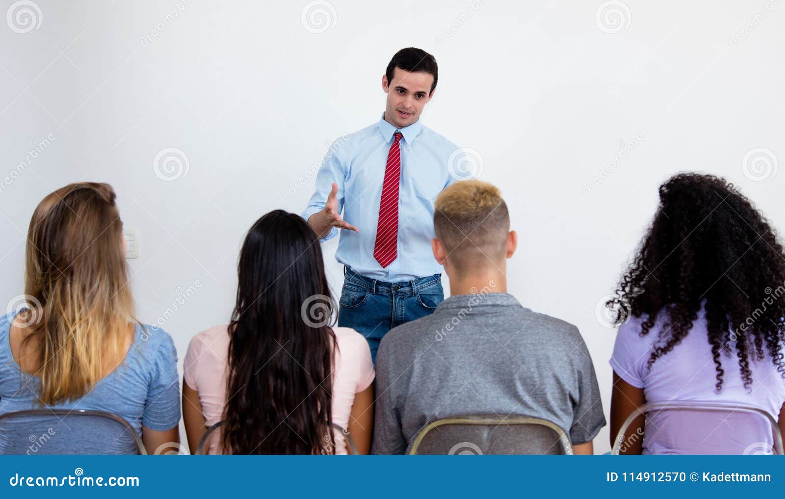 Teacher Speaking To Students at Classroom Stock Photo - Image of female ...