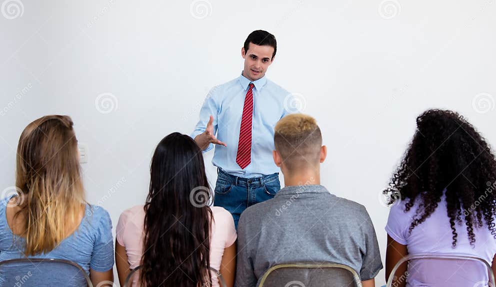 Teacher Speaking To Students at Classroom Stock Photo - Image of female ...