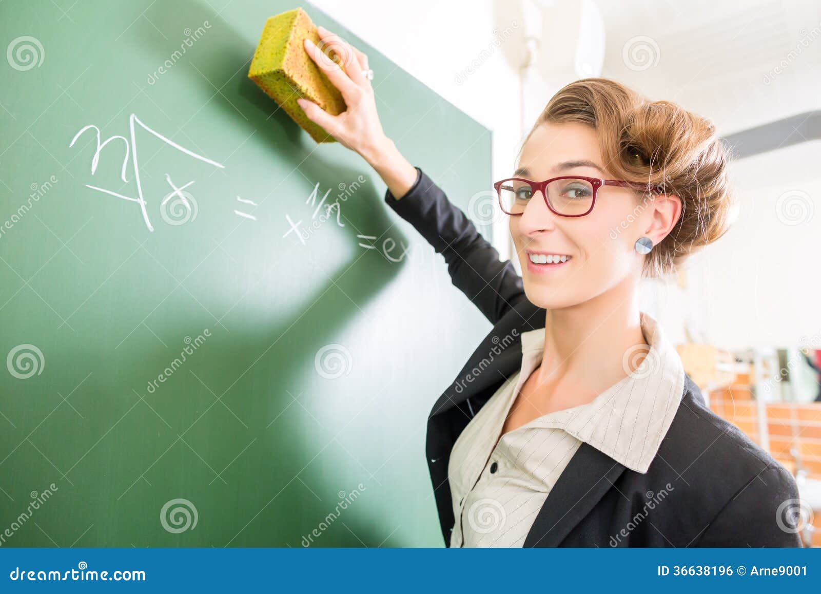 Teacher with a Sponge in Front of a School Class Stock Photo - Image of ...