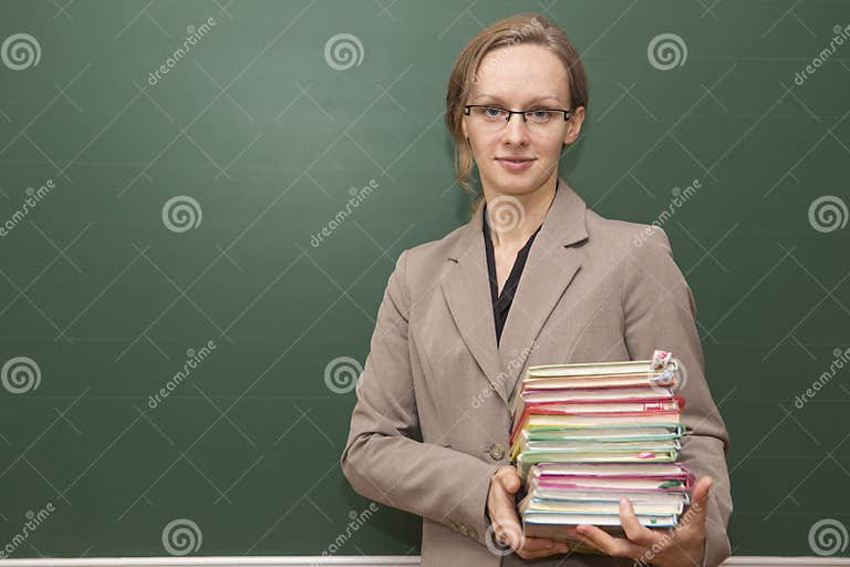 Teacher with Stack of Books Stock Photo - Image of teacher, wait: 33289788