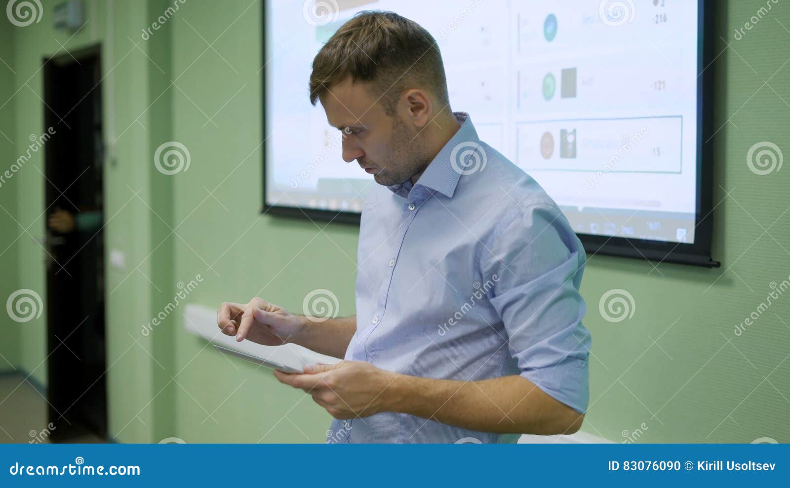 Teacher Standing Alone in Front of Class of Students and Touching His ...