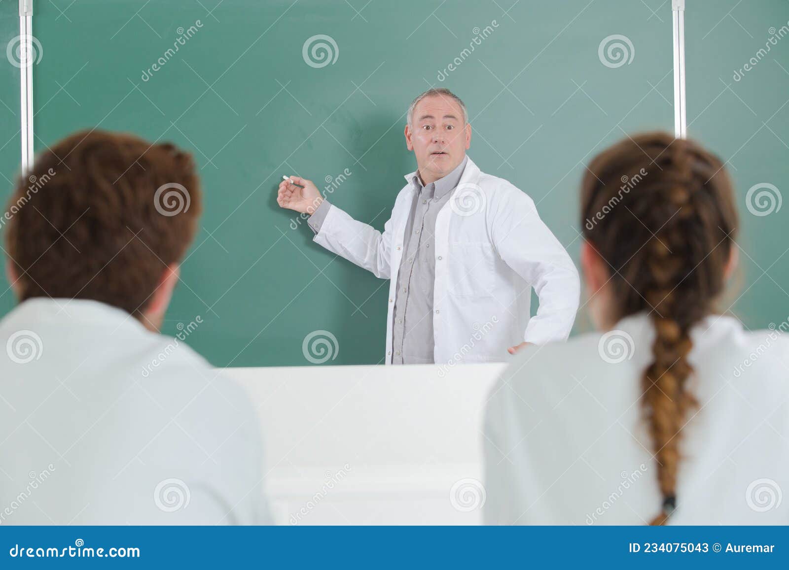 Teacher Standing in Front Board and Students in Classroom Stock Image ...