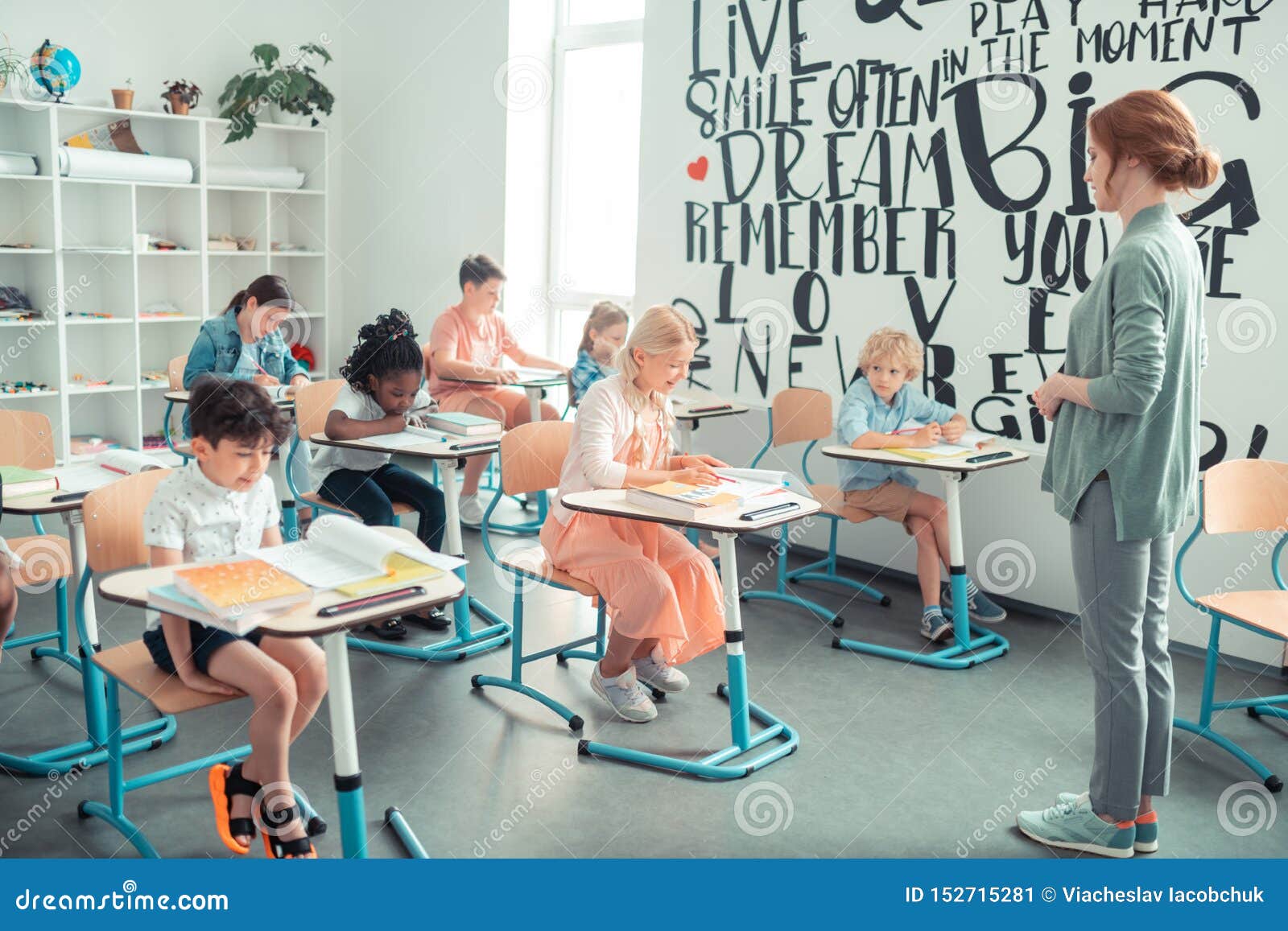 Teacher Standing in Front of Class Explaining New Topic. Stock Image ... Teacher Standing in Front of Class Explaining New Topic. Stock Image ...