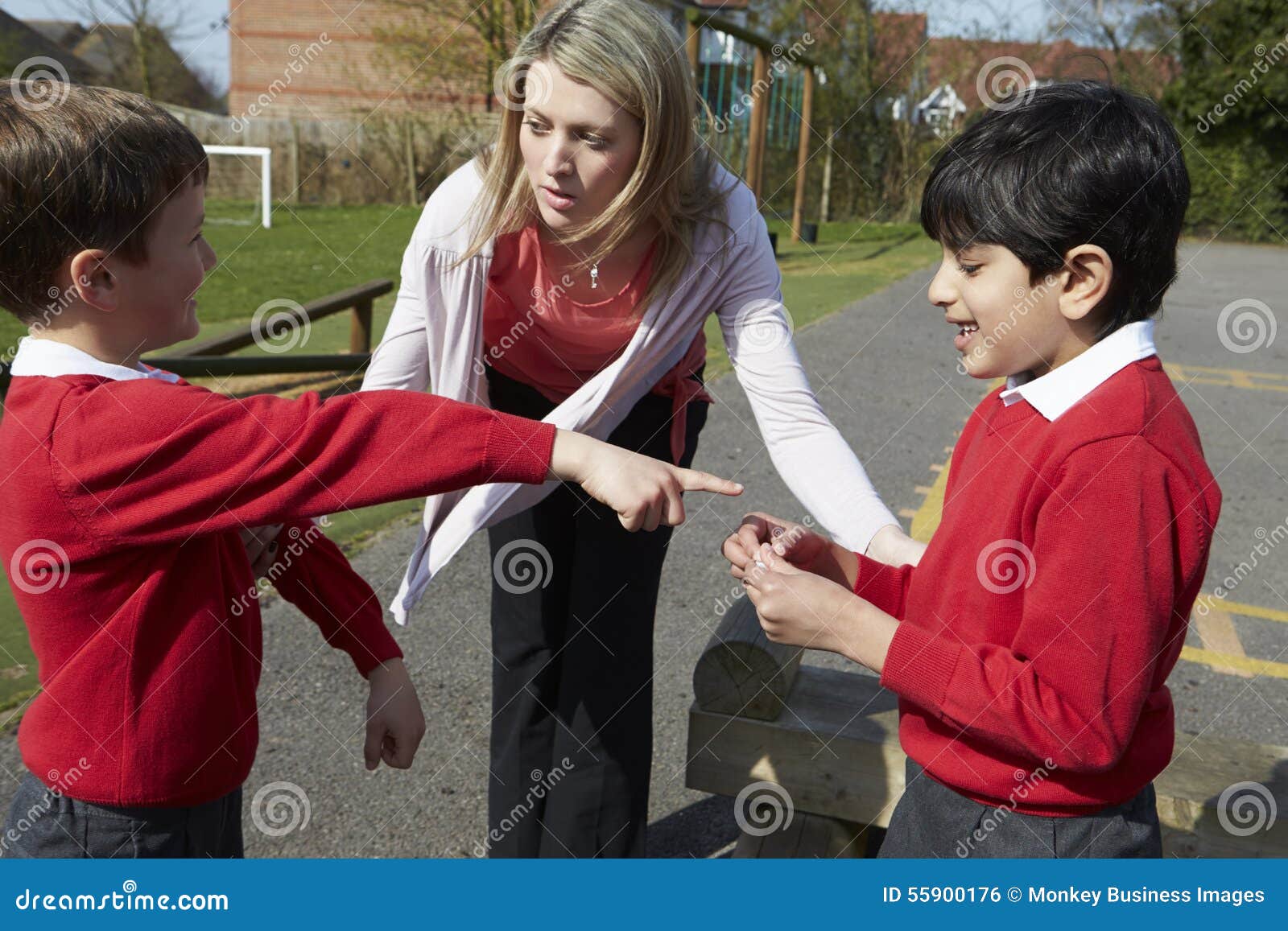 Teacher Stopping Two Boys Fighting in Playground Stock Photo - Image of ...