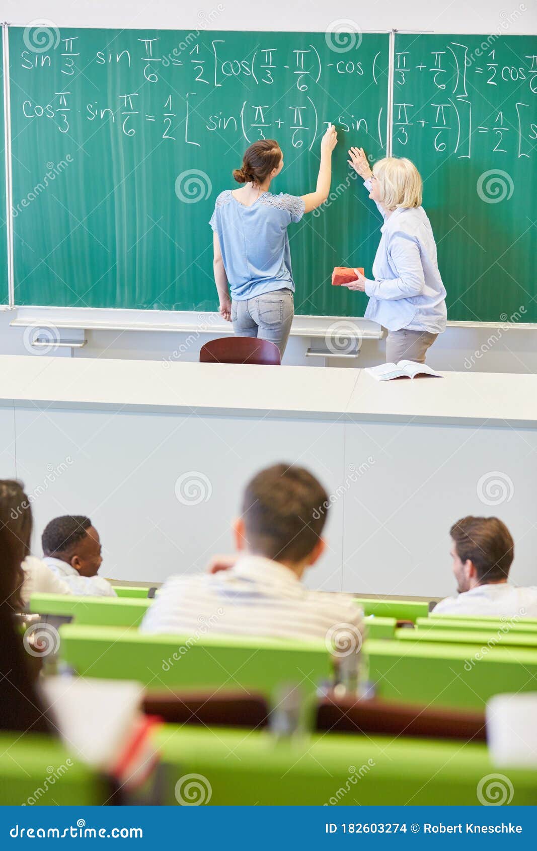 Teacher with Student on Blackboard in University Stock Photo - Image of ...