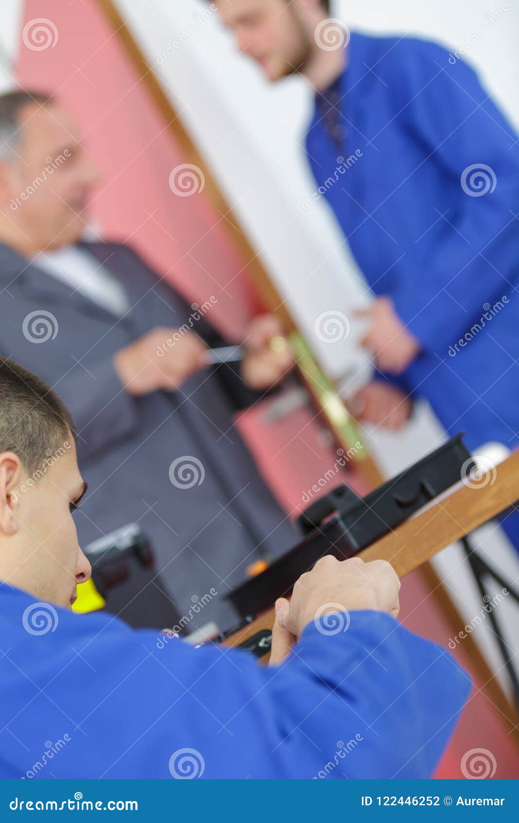 Teacher with Student in Carpentry Class Fitting Door Lock Stock Photo ...