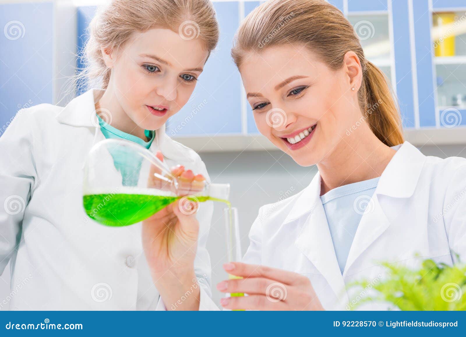 Teacher and Student Chemists Making Experiment in Laboratory Stock ...