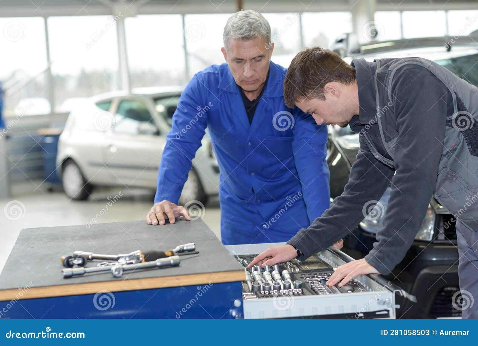 Teacher and Student Choosing Appropriate Tools in Mechanic School Stock ...