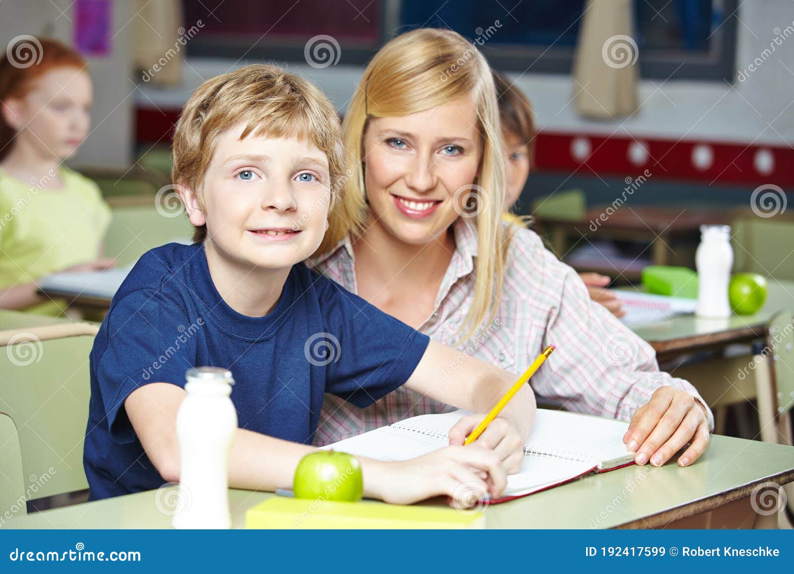 Teacher with Student in Class Stock Image - Image of elementary, pupil ...