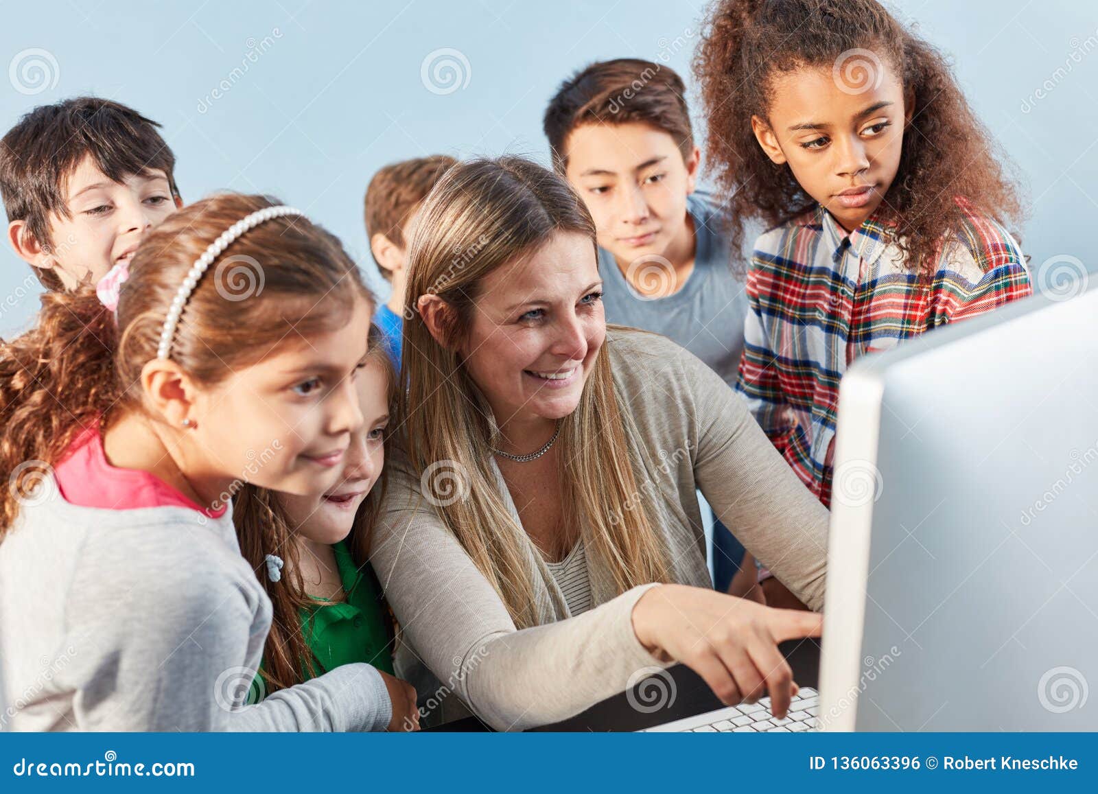 Teacher and Student Group at the Computer Stock Photo - Image of ...