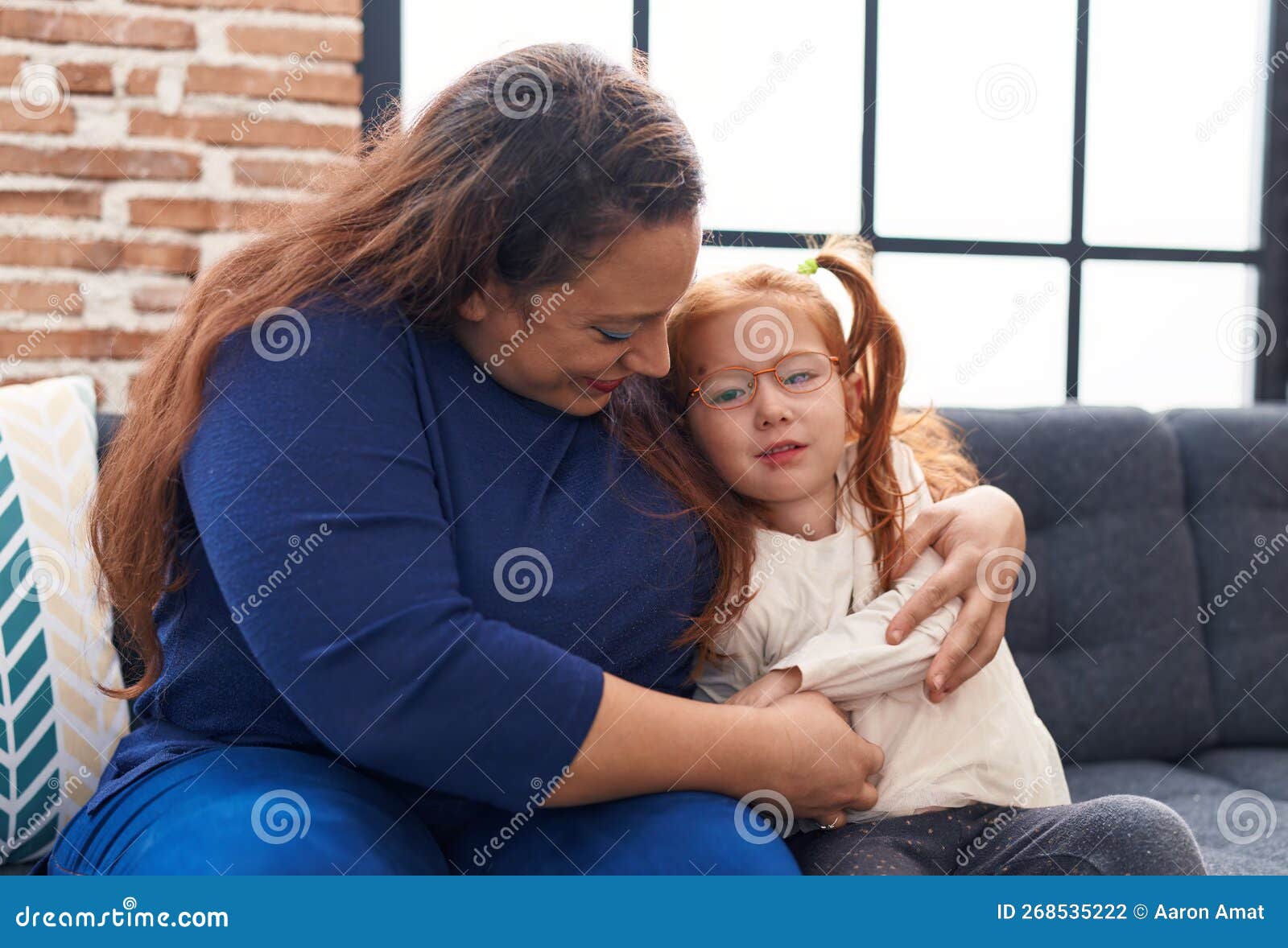 Teacher and Student Hugging Each Other Sitting on Sofa at Home Stock ...