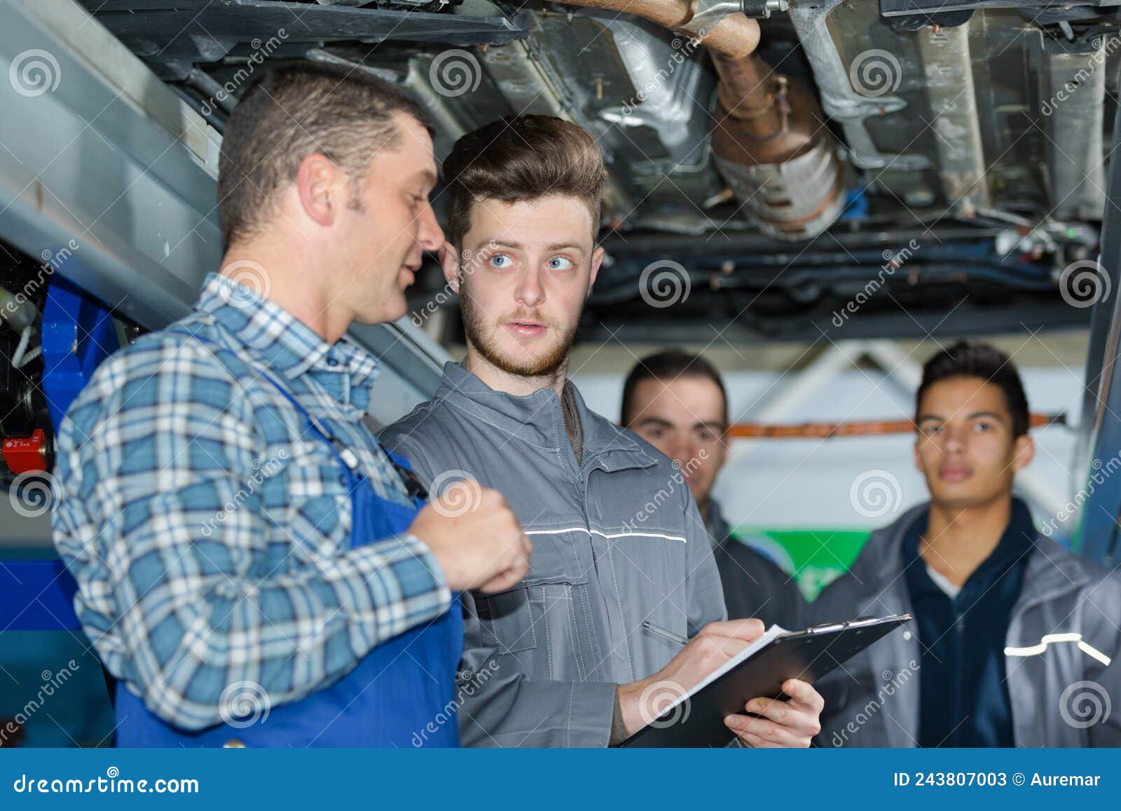 Teacher with Student in Mechanics Class Stock Image - Image of ...