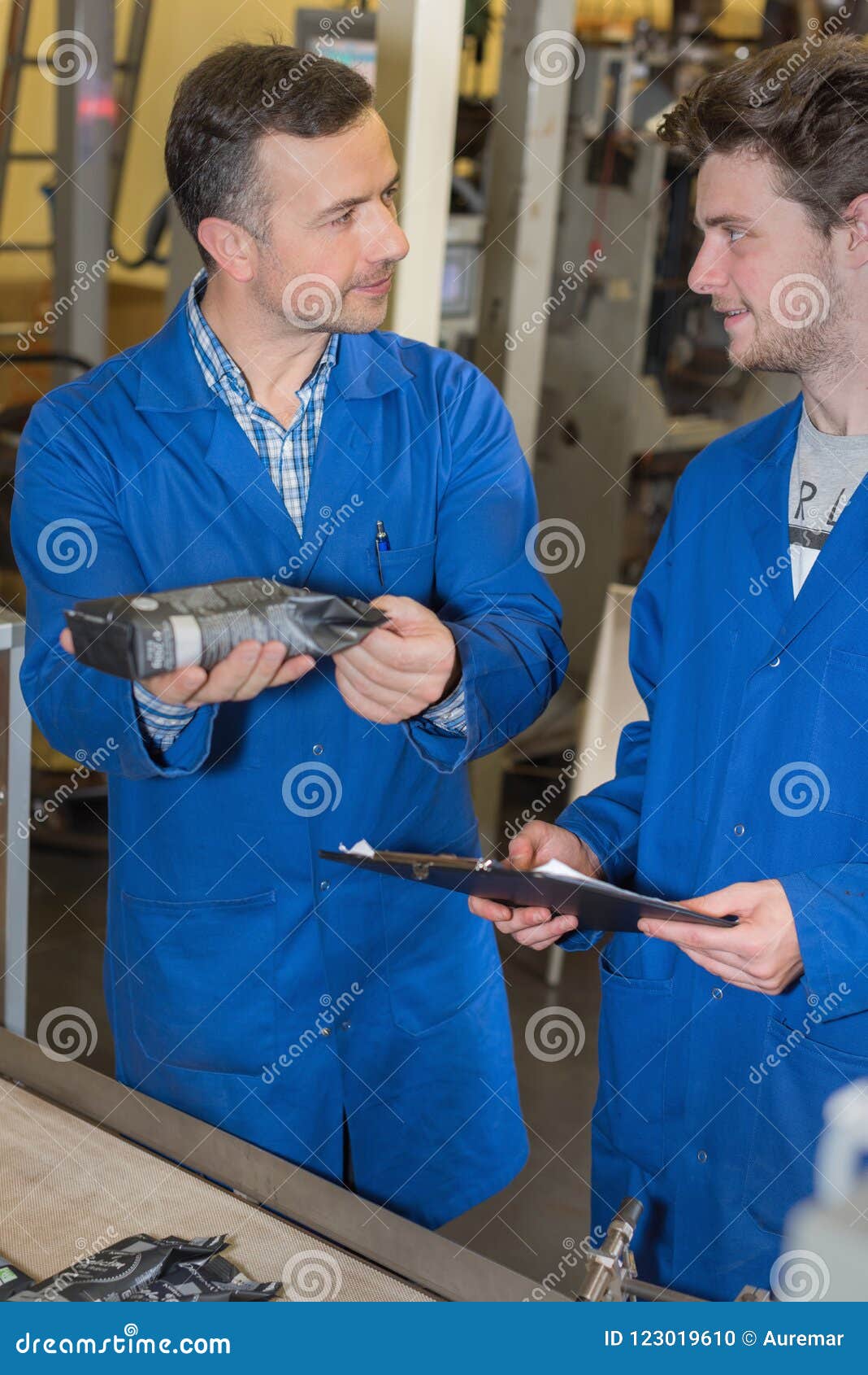 Teacher with Student in Mechanics Class Stock Photo - Image of ...