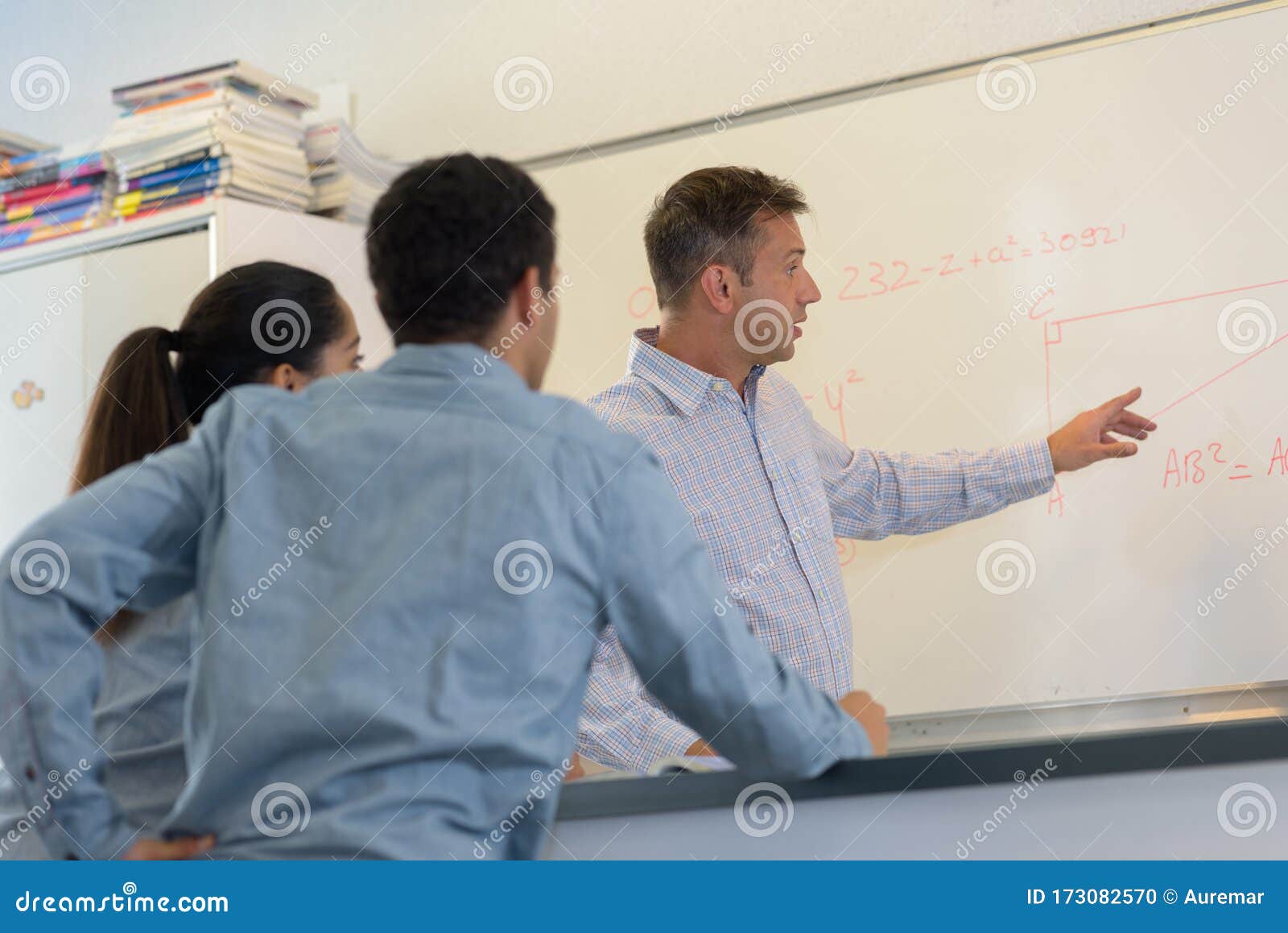 Teacher and Student Pointing To Board Stock Photo - Image of attention ...