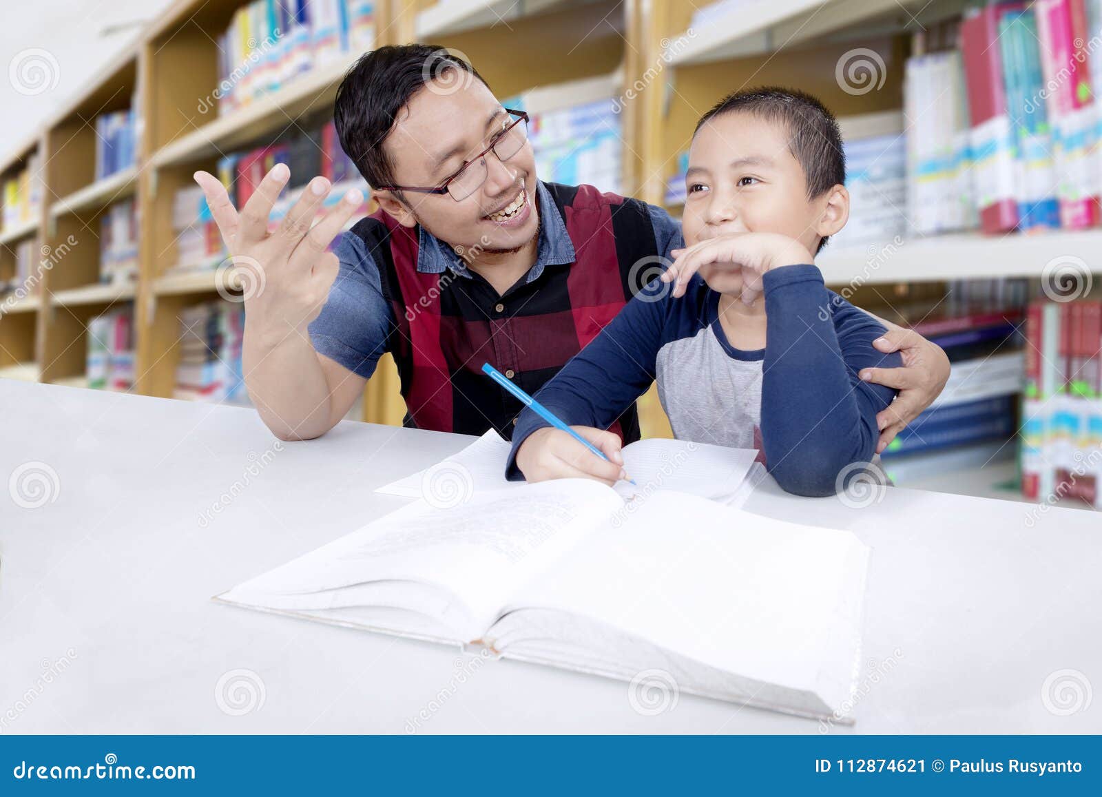 Teacher and Student Studying Math in the Library Stock Image - Image of ...