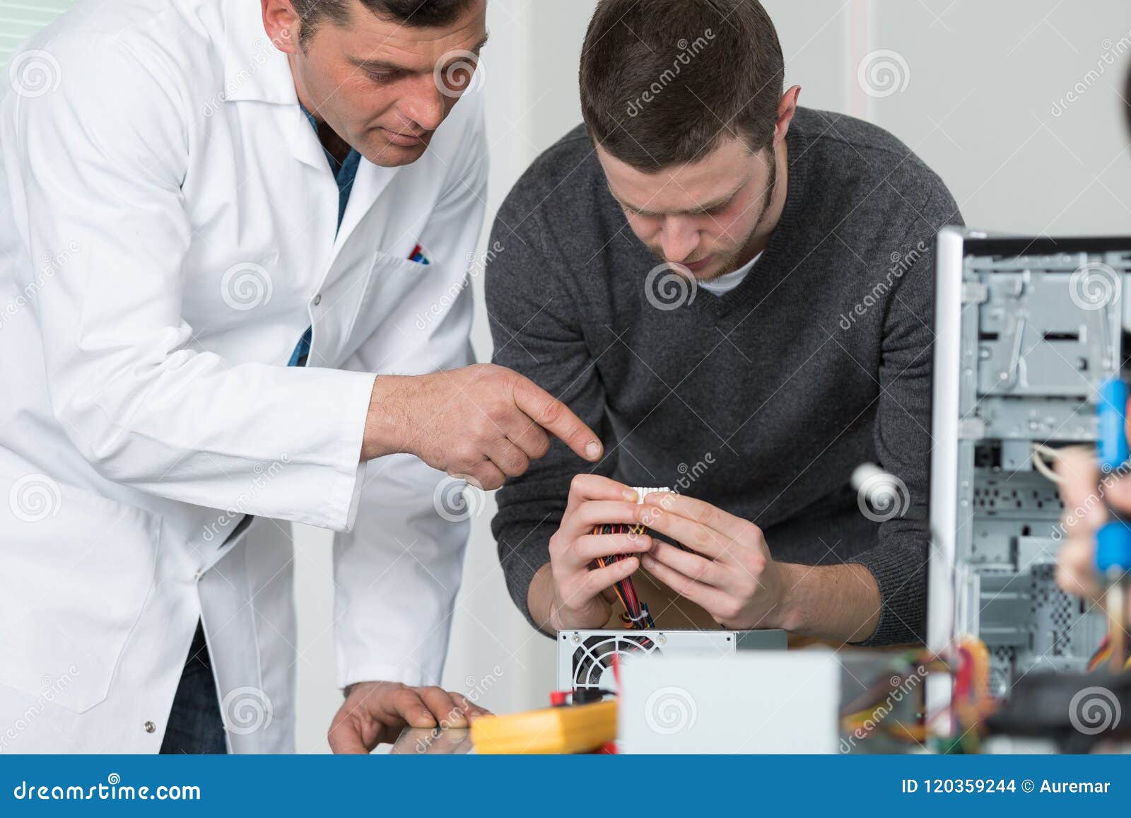 Teacher with Student in Technology Repairing Computer Stock Photo ...
