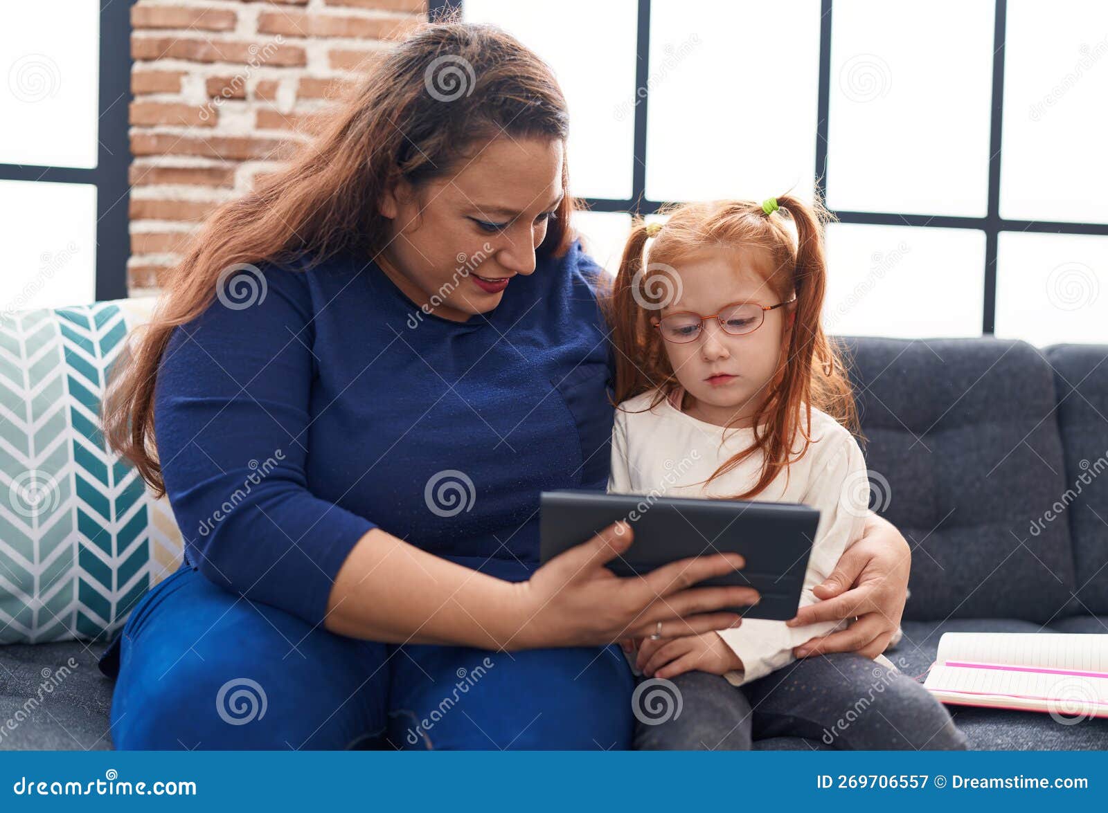Teacher and Student Using Touchpad Sitting on Sofa at Home Stock Image ...