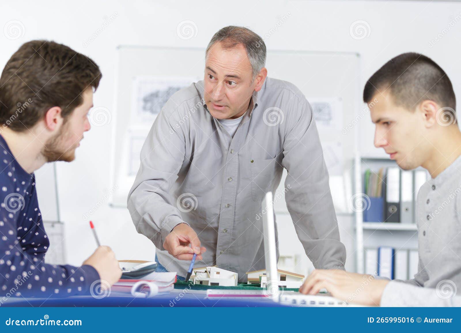 Teacher and Student Work Together at Adult Education Class Stock Photo ...