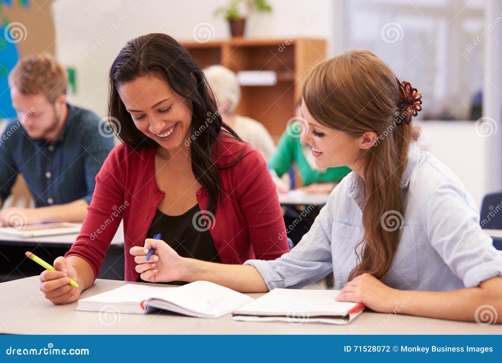 Teacher and Student Work Together at Adult Education Class Stock Photo ...