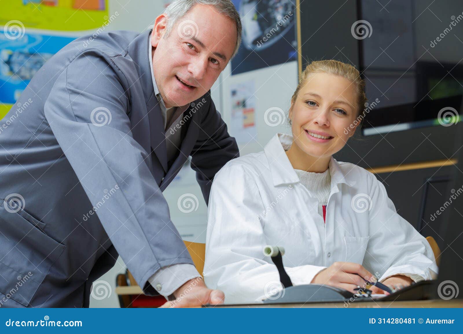Teacher with Student Working on Desktop Computer Stock Image - Image of ...