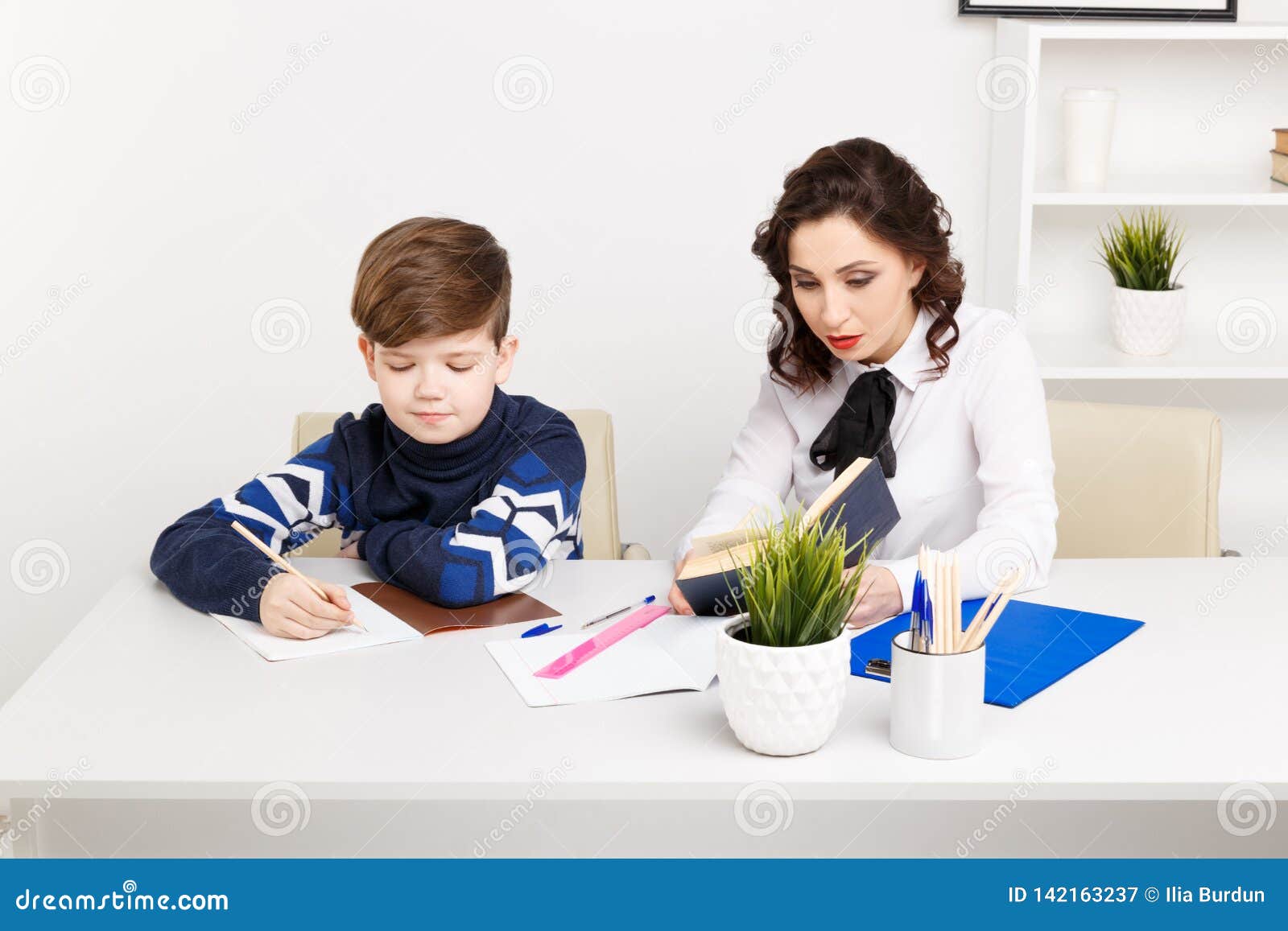 Teacher and Student Working Together and Getting New Information. Stock ...