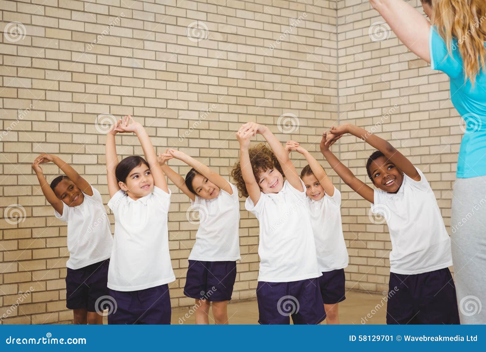 Teacher and Students Doing Stretches Stock Image - Image of female ...