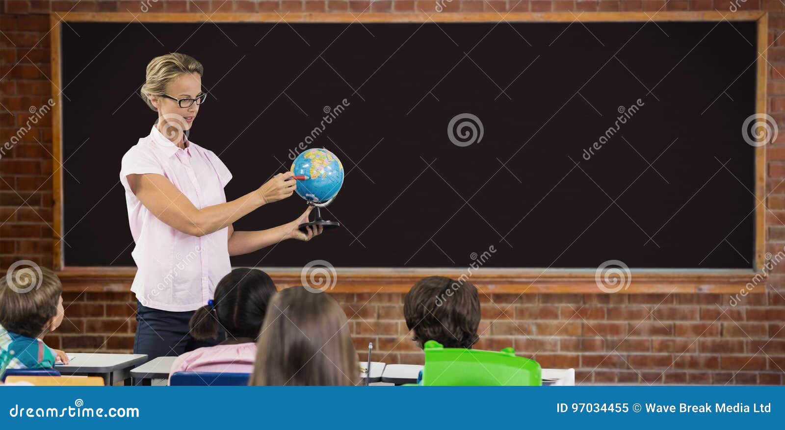 Composite Image of Teacher with Students Holding Globe Stock Image ...