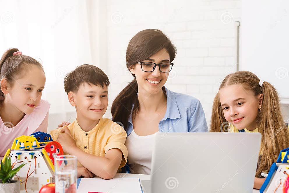 Teacher and Students Learn about Robotics Using Laptop Computer Stock ...