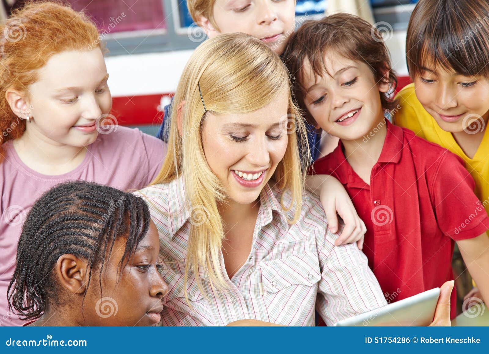 Teacher and Students Looking at Tablet Computer Stock Photo - Image of ...