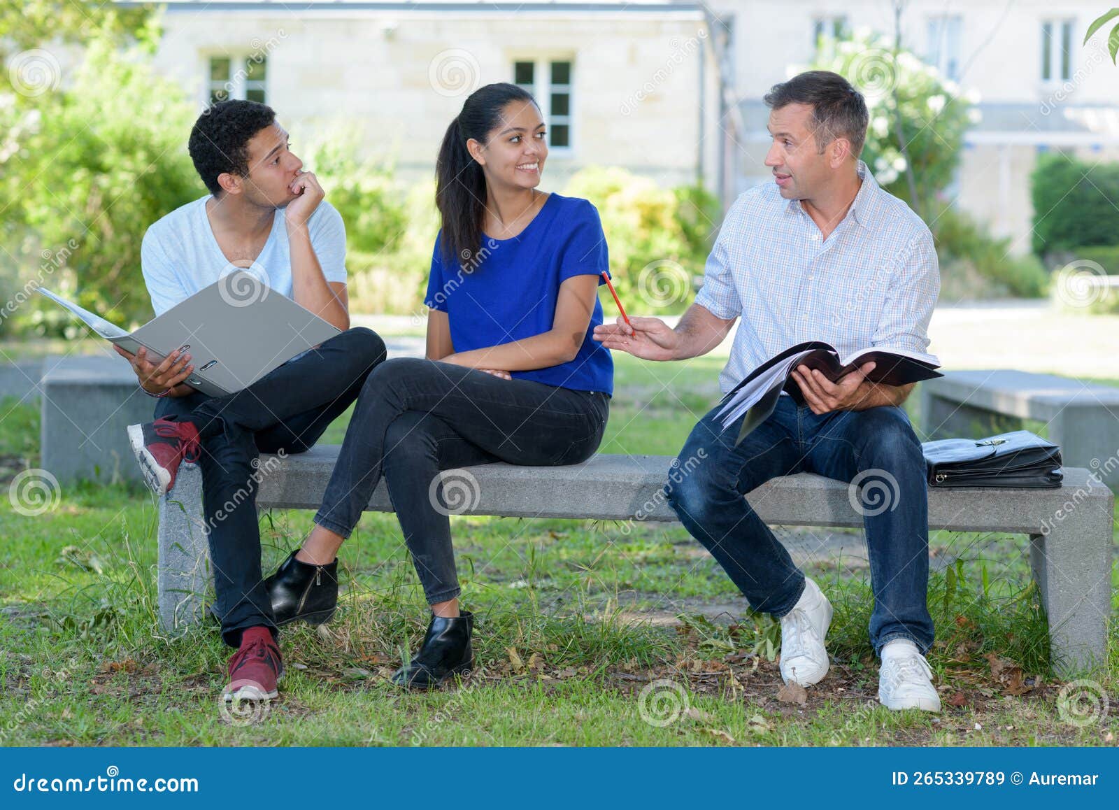 Teacher and Students Sat on Bench in University Campus Stock Image ...