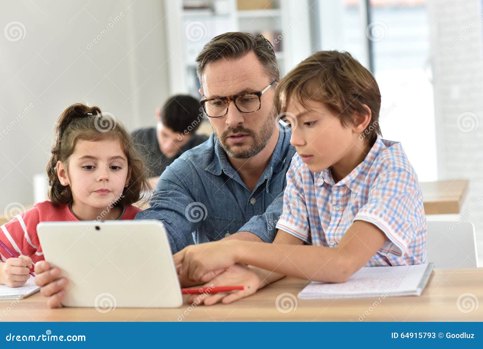 Teacher with Students Using Tablet Stock Image - Image of group, table ...
