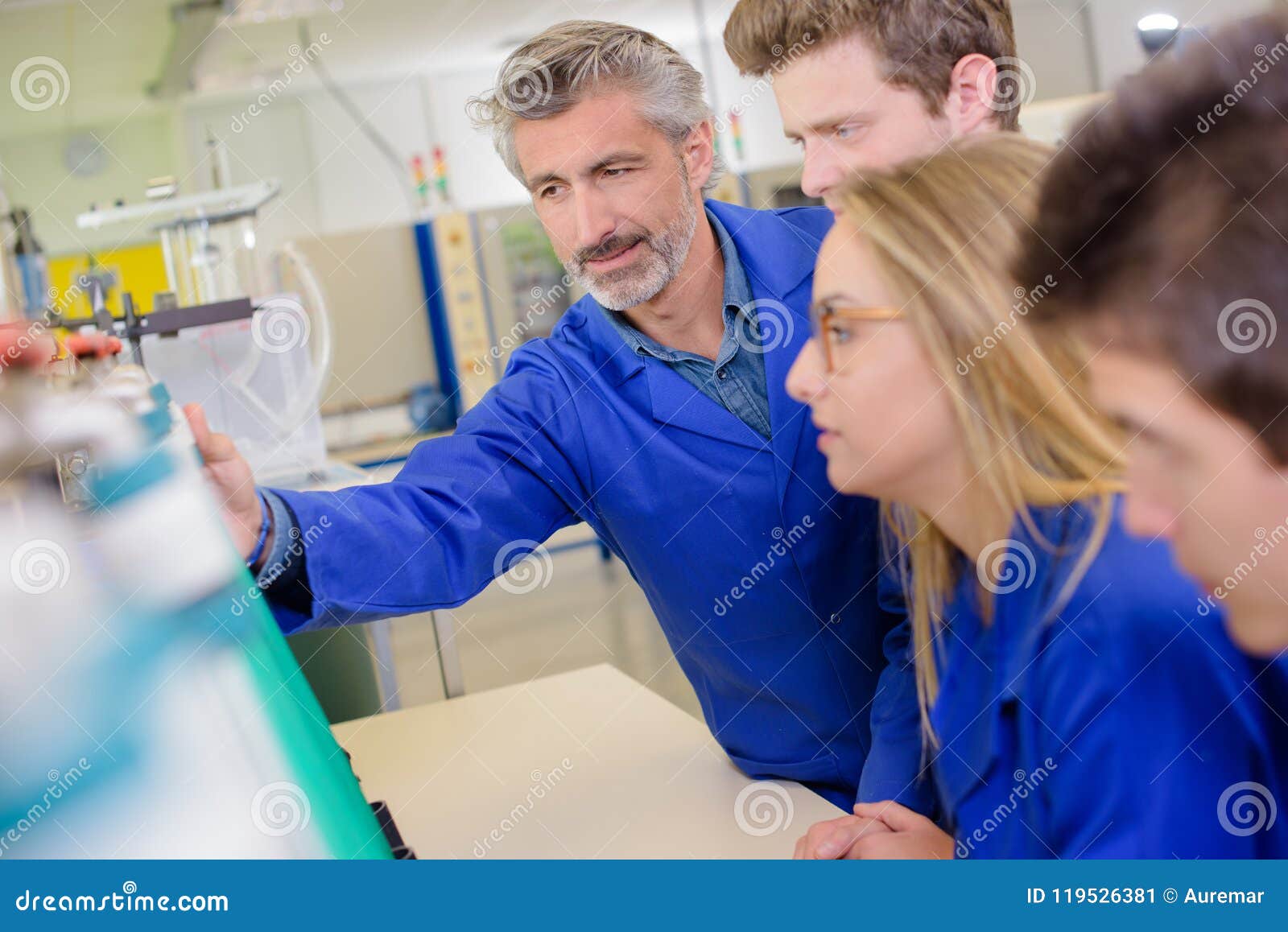 Teacher with Students Wearing Blue Jackets Stock Image - Image of ...