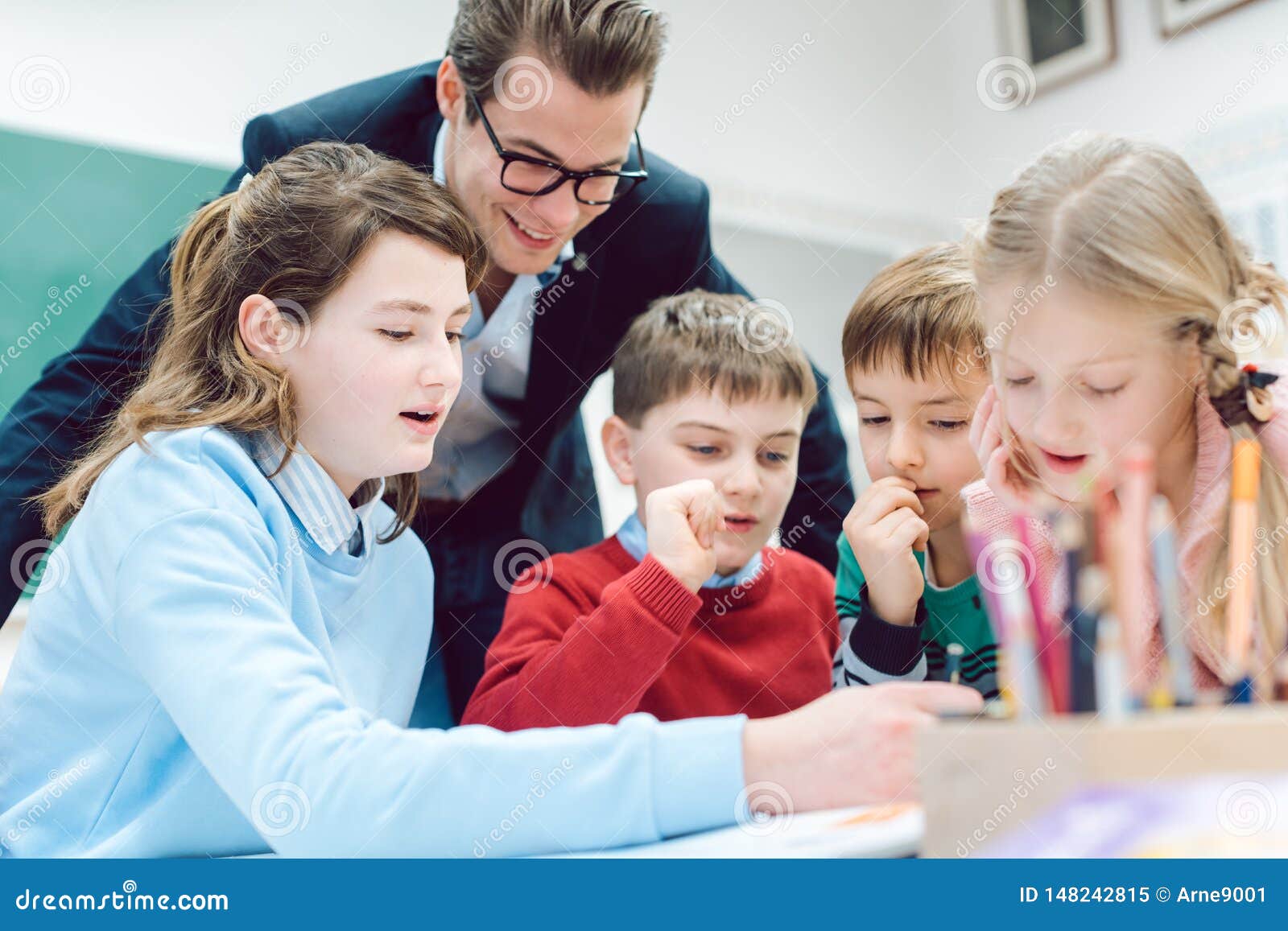 Teacher and Students Working Together in a Group or Team Session Stock ...