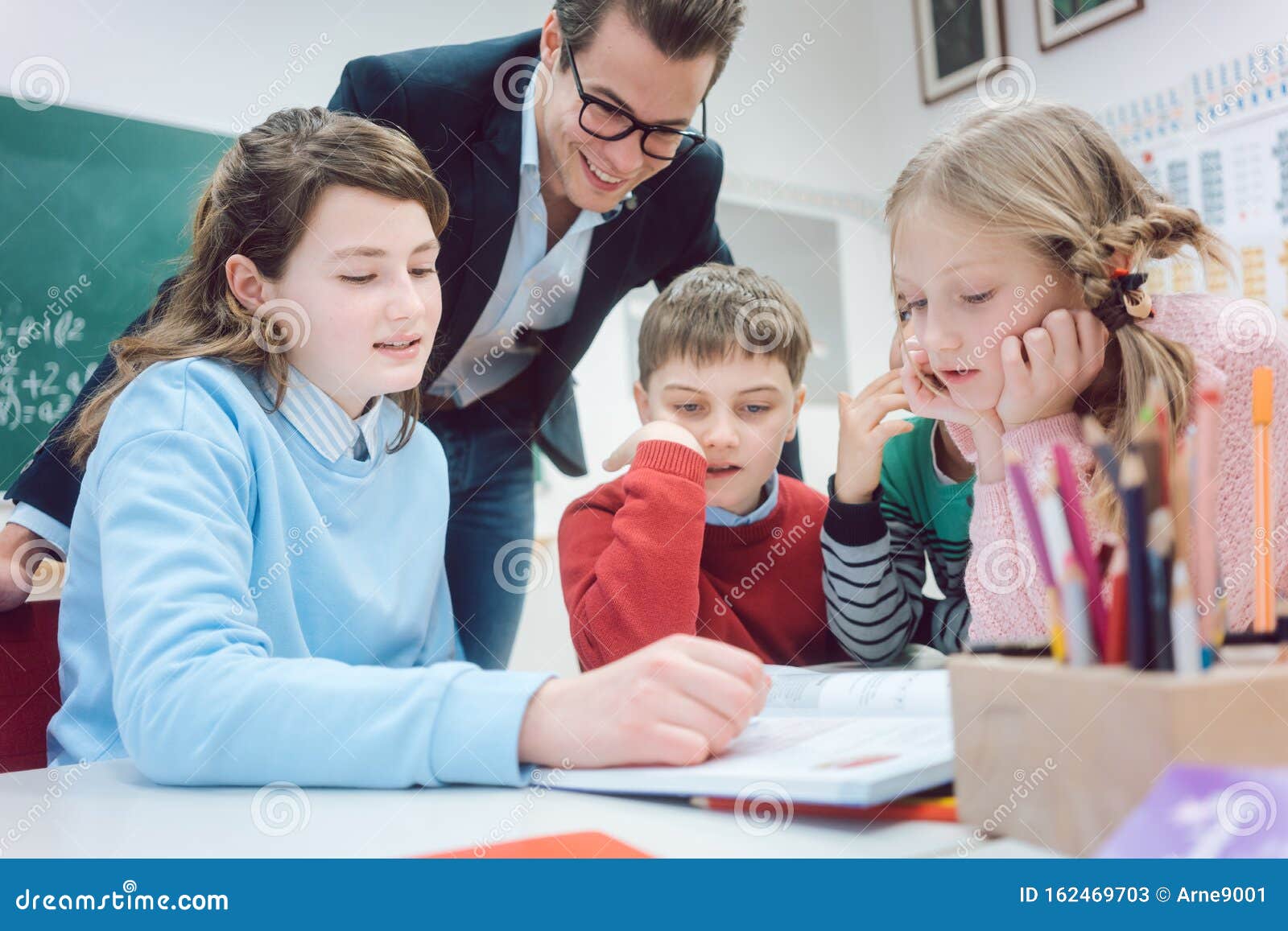 Teacher and Students Working Together in a Group or Team Session Stock ...