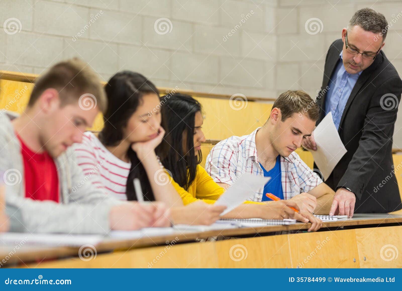 Teacher with Students Writing Notes in Lecture Hall Stock Image - Image ...