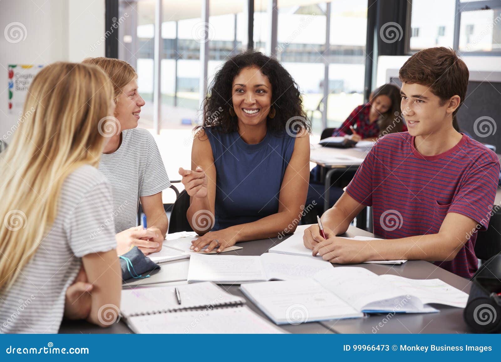 Teacher Studying School Books in Class with High School Kids Stock ...