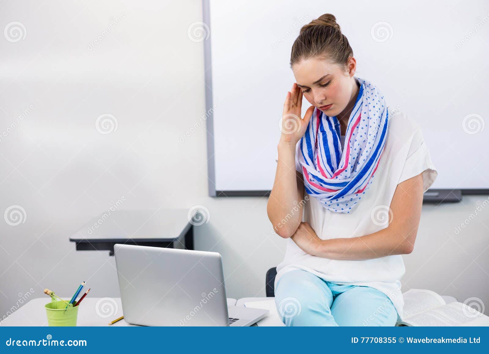 Teacher Suffering from Headache while Sitting in Classroom Stock Image ...