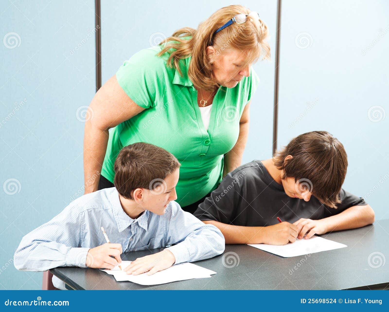 Teacher Supervises Testing stock photo. Image of middle - 25698524