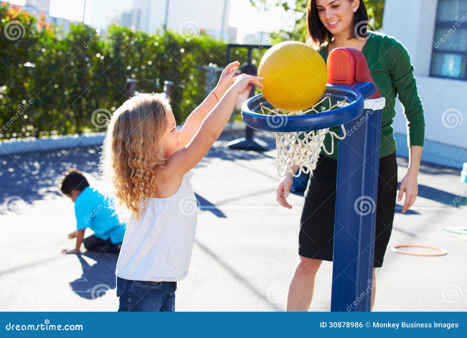 Teacher Supervising Breaktime at Elementary School Stock Photo - Image ...
