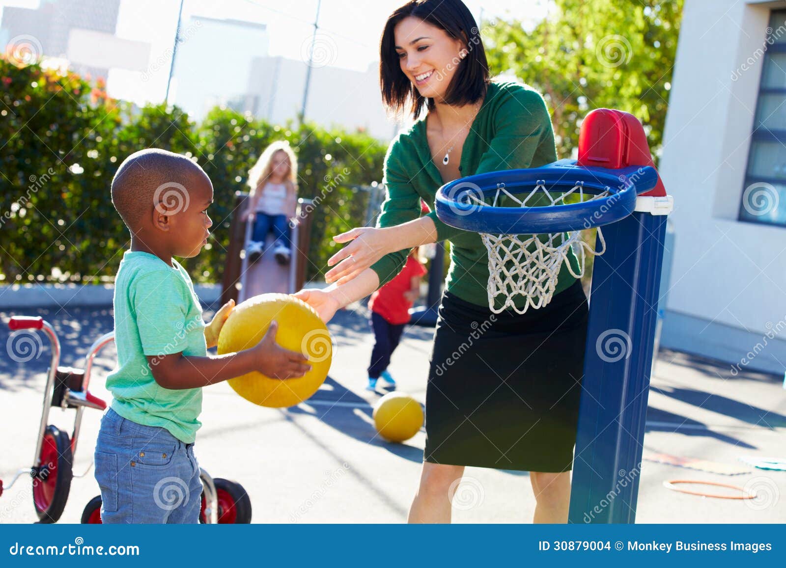 Teacher Supervising Breaktime at Elementary School Stock Photo - Image ...