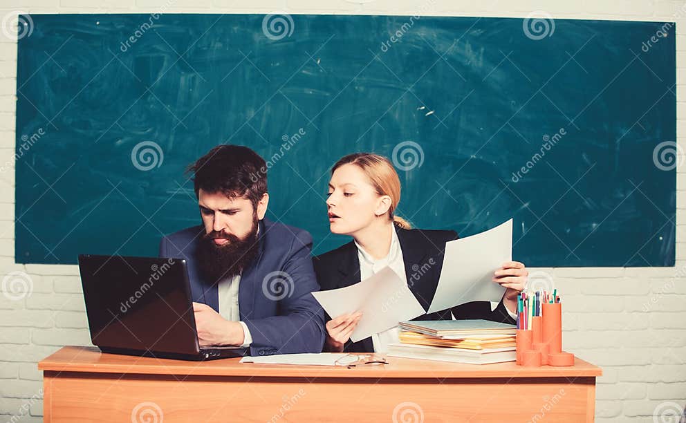 Teacher and Supervisor Working Together in School Classroom. School ...