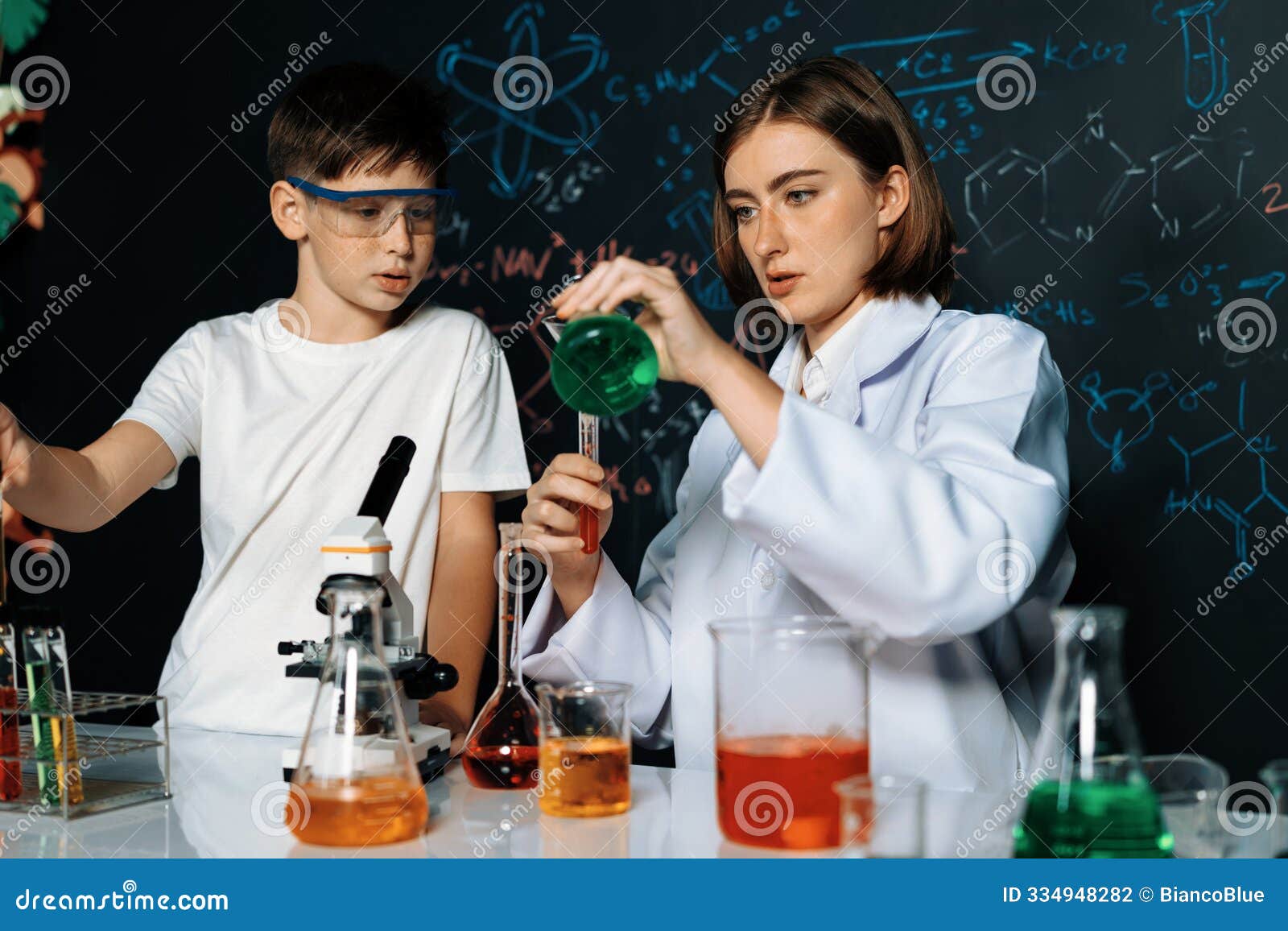 Teacher Support Schoolboy Mixing Solution in Laboratory STEM Class ...