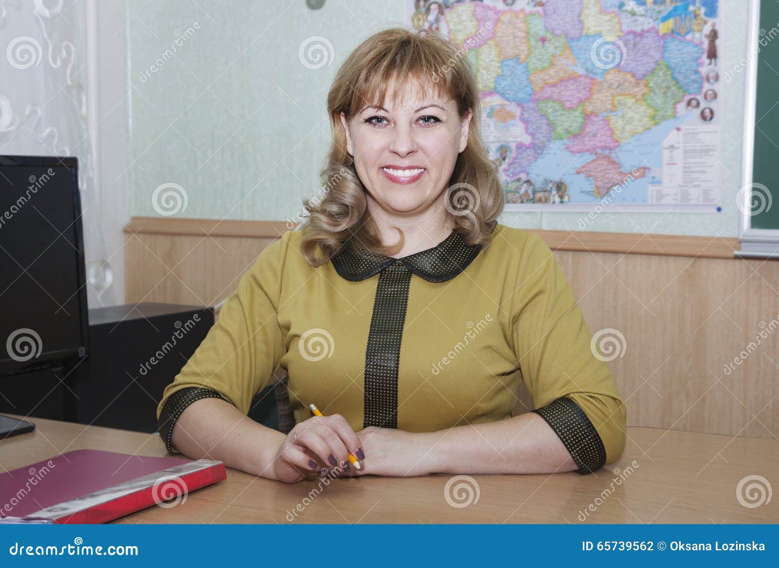 Teacher at the table stock photo. Image of studying, desk - 65739562