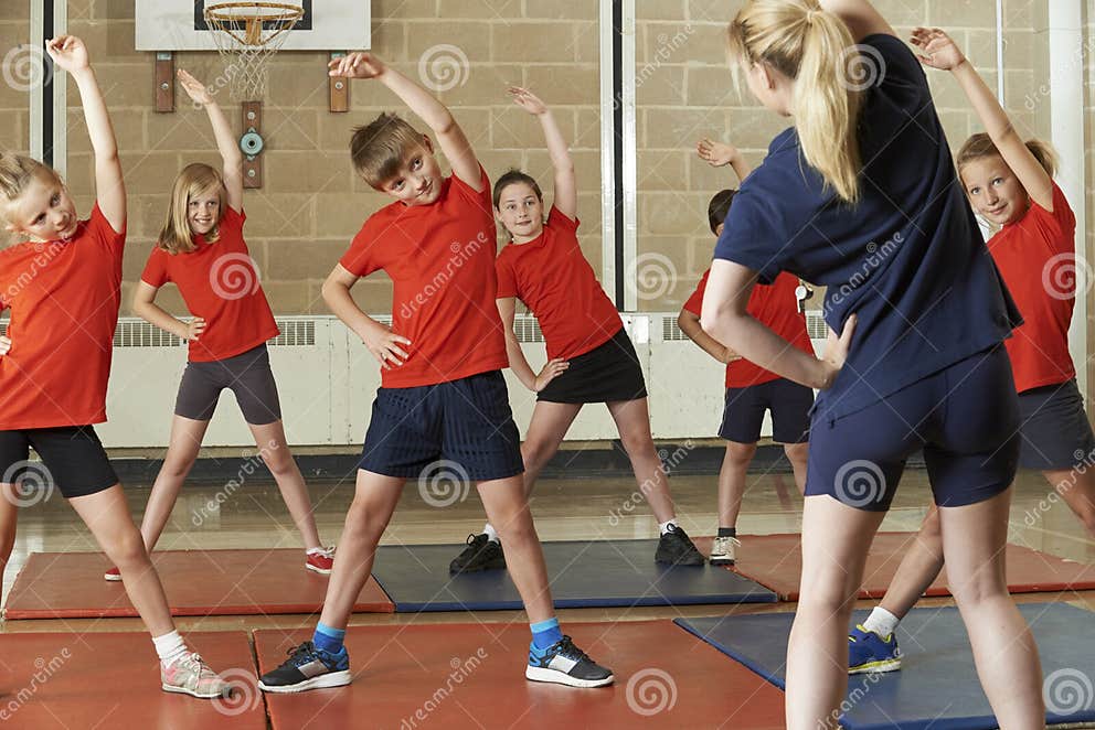 Teacher Taking Exercise Class in School Gym Stock Image - Image of ...