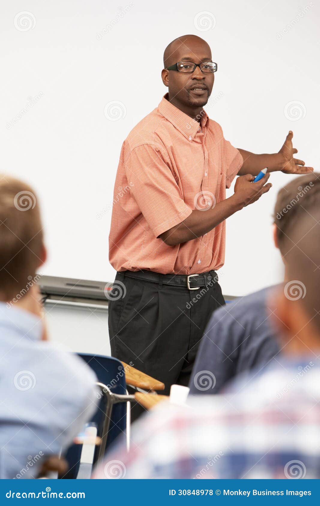 Teacher Talking To Class Standing in Front of Whiteboard Stock Photo ... Teacher Talking To Class Standing in Front of Whiteboard Stock Photo ...